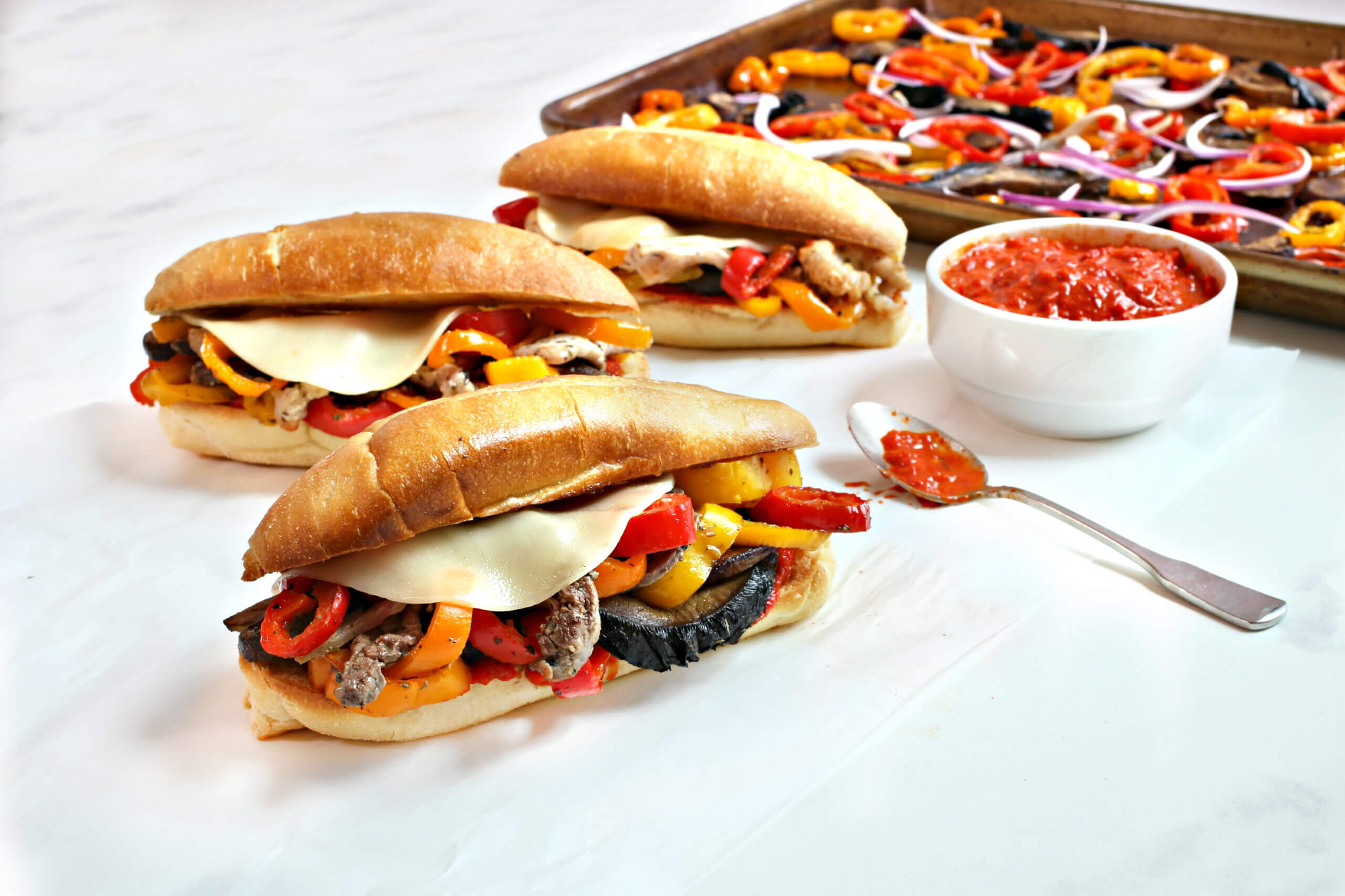 Sweet Italian Pepper Cheesesteaks with Smoky Red Pepper Aioli - NatureSweet